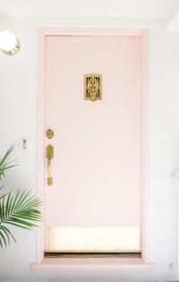 Ring the Pineapple Doorbell on This Blushing Pink Cottage