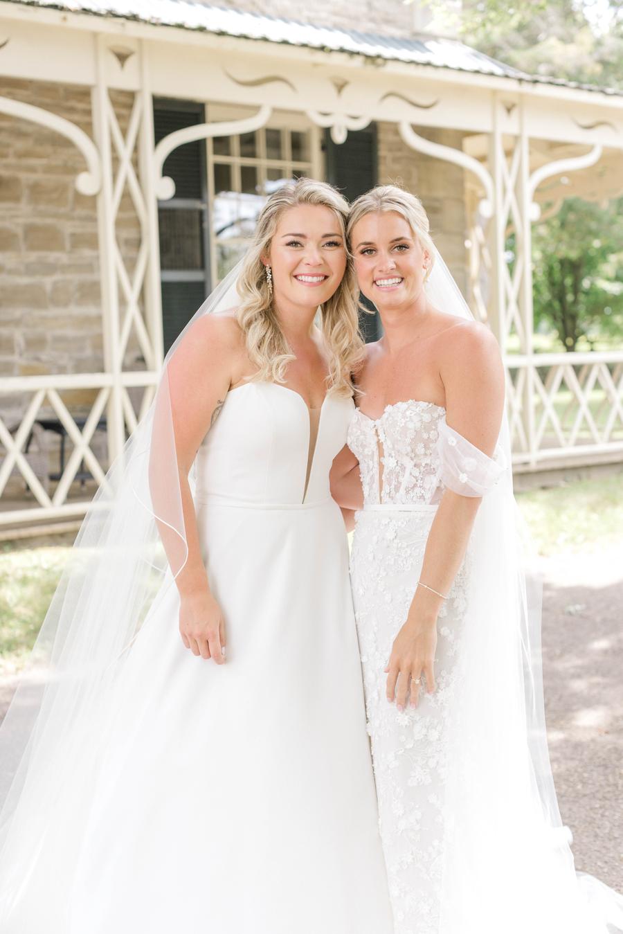 Two Brides' Special Day Under A Lush Display of Baby's Breath & Roses